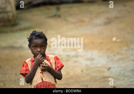 A young Baka pygmy child in a remote village in the rainforest ...