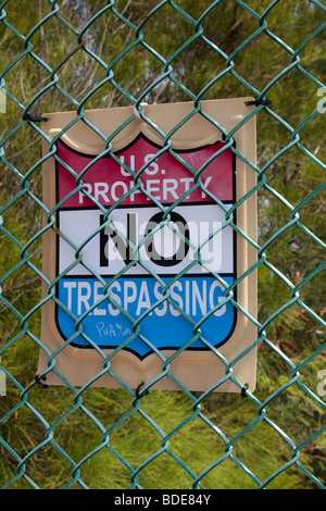US Government no trespassing sign against a blue sky Stock Photo - Alamy