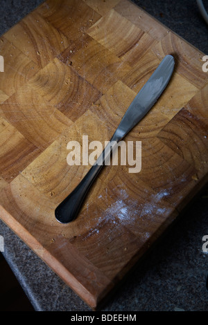 Dirty kitchen chopping board and knife Stock Photo: 11640030 - Alamy
