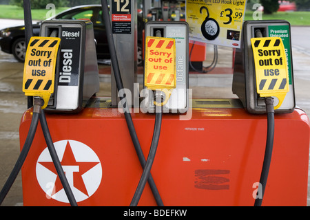 A petrol station with petrol and diesel pumps out of fuel with signs ...