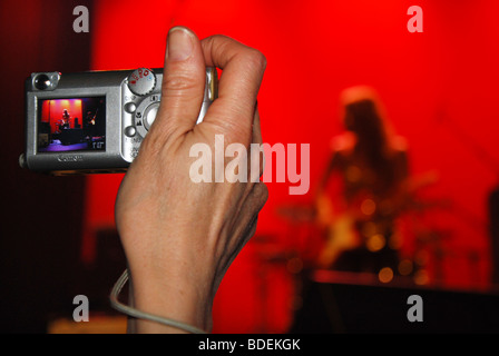 spectator taking snapshot at rock concert with digital camera Stock ...