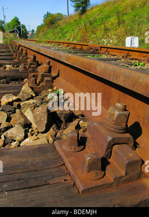 railroad track with stake and rust Stock Photo - Alamy