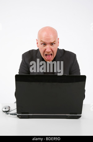 bald headed man looking appalled at his laptop Stock Photo - Alamy