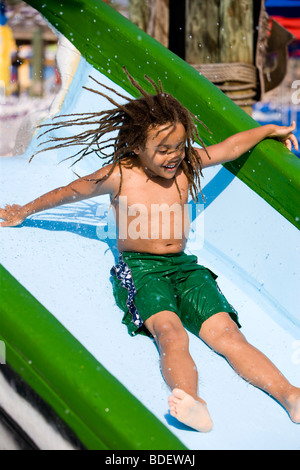 teen boy male waterslide water slide fun thrill tube excite swim suit ...