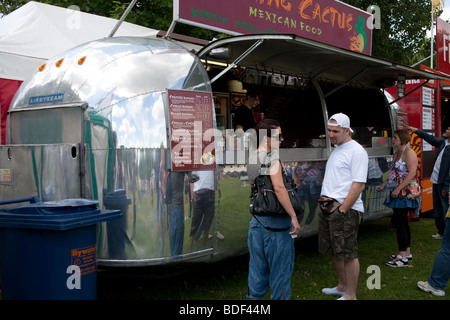 band concert crowd fun fair lake district swings tents young Stock ...