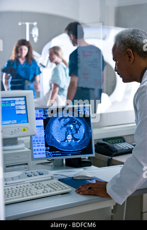 Woman observing a technician machine Stock Photo - Alamy