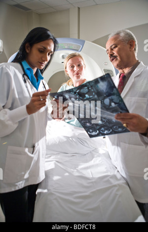 Doctors reviewing CT scan results with patient Stock Photo - Alamy