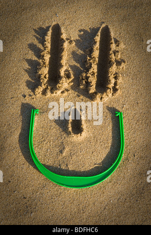 smiling smiley on wet sand near the sea Stock Photo - Alamy