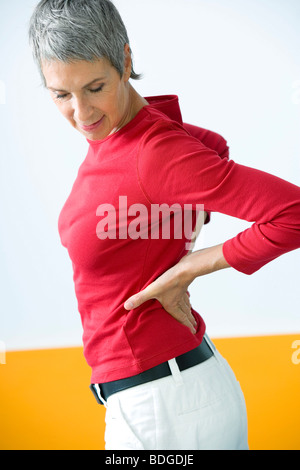 LOWER BACK PAIN IN ELDERLY PERS Stock Photo - Alamy