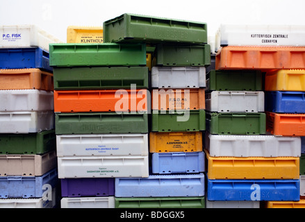Blue plastic fish boxes stacked up at the harbour of a fishing Stock ...