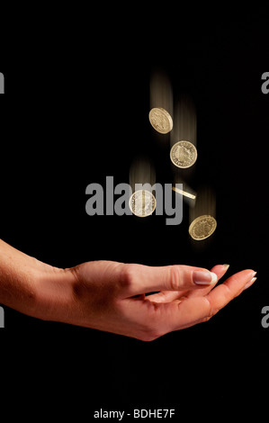 Catching falling coins Stock Photo - Alamy