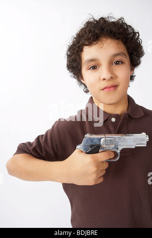 10-12 year old Hispanic American boy outside contemplating life. MR ...