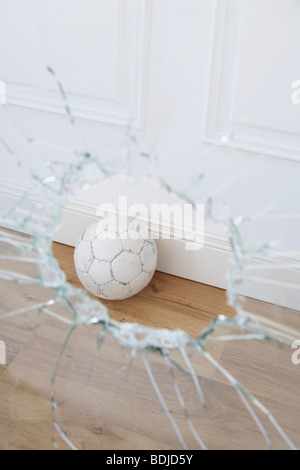 Soccer Ball and Broken Window Stock Photo - Alamy