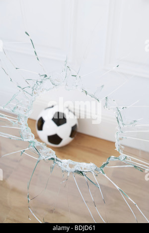 Damaged soccer ball Stock Photo - Alamy