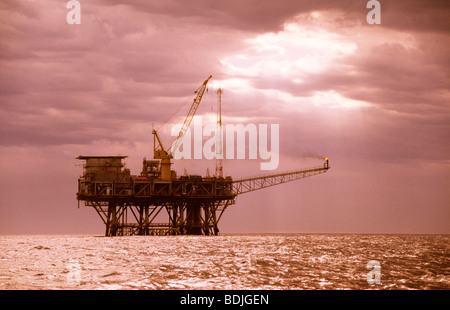 Australia. Bass Strait. Off shore oil and gas field and rig at sunrise ...