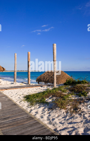 Serene Tropical Beach With Dock And Hut Under Clear Blue Sky, Isla ...