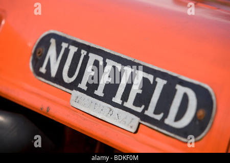 tractor badge on a old tractor Stock Photo - Alamy