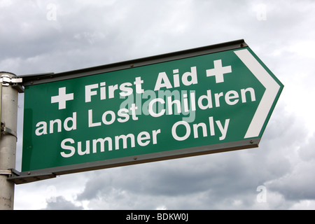 First aid post lost children Information point sign on black shed Stock ...