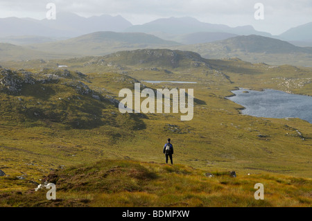 Walker descending south from Conostom, Isle of Lewis, Scotland Stock ...