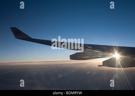 airplane wing at night dusk sunburst sunset plane Stock Photo - Alamy