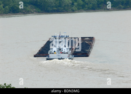 A push boat guides a barge down the Ohio River in Cincinnati, Ohio ...