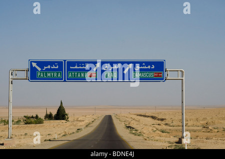 Road signs along a Syrian highway point the way to Baghdad, Iraq and ...