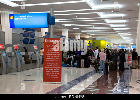 Check in hall in terminal three departure lounge with the control tower ...