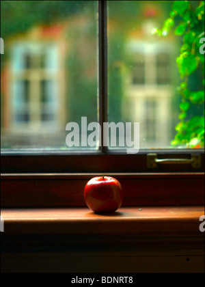 Red apple on a window ledge, in Oxford Stock Photo - Alamy