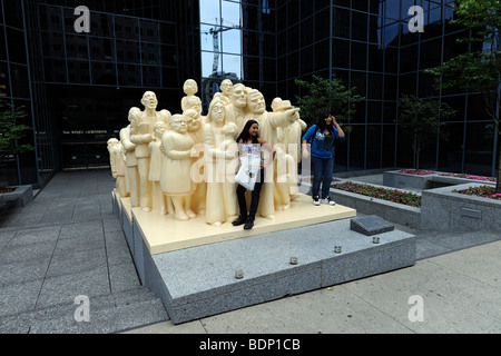 Illuminated Crowd Sculpture by Raymond Masson in front of a Stock Photo ...