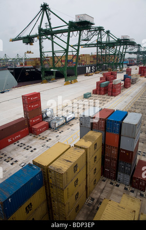 shipping container boxes teu teus in the port stacks with gantry crane ...