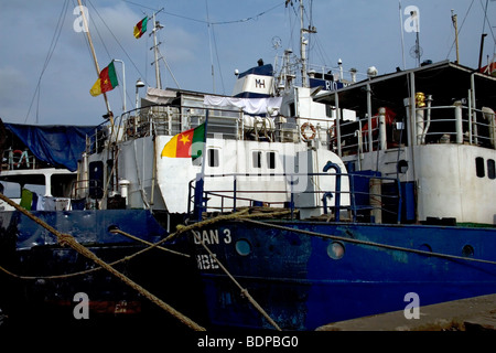 Dock scene at Douala Cameroon West Africa with coastal trading vessel ...