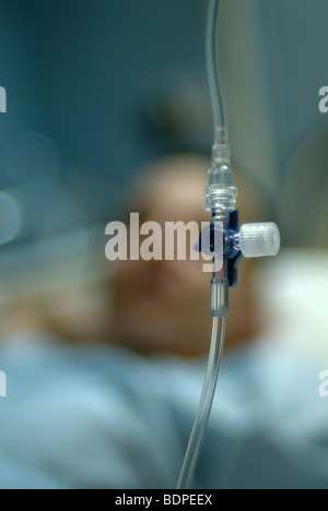 MODEL RELEASED. Intravenous drip. Patient connected to an intravenous ...