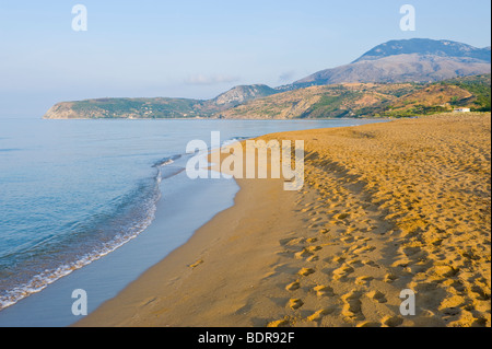 View over the blue flag Mounda beach in early evening light on the ...
