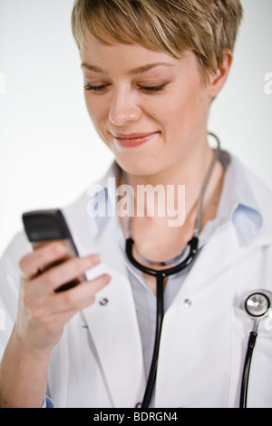 Female doctor telephoning Stock Photo - Alamy