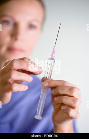 Nurse preparing injection close-up Stock Photo - Alamy