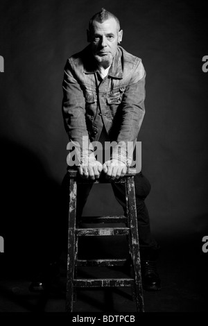 Alternative looking man taking a powerful position of dominance Stock ...