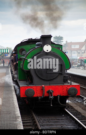 An M&GN (Midland and Great Northern) steam engine with trucks, and a ...