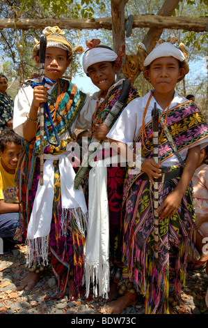 TIMOR LESTE Boys wearing traditional dress including ikat weaves and ...