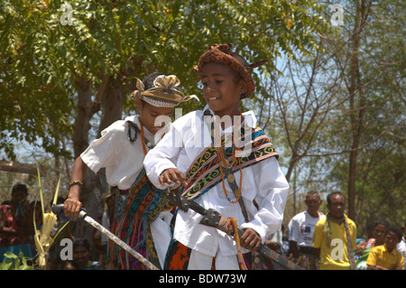 TIMOR LESTE Boys wearing traditional dress including ikat weaves and ...