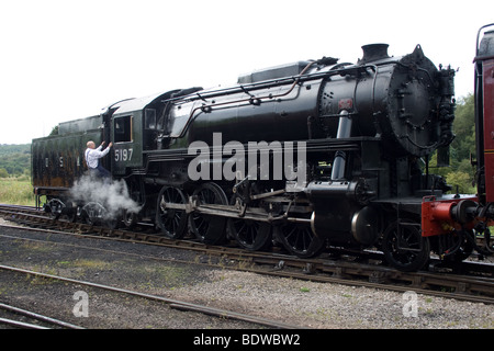 Lima USATC locomotive No. 5197 coupled to GWR Large Prairie No. 5199 at Cheddleton station Stock ...
