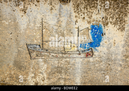 Pictures of boats are etched into the concrete harbour walls at Harrow ...