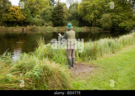 Fisherman fly fishing at Avington Trout Fishery, Winchester, Hampshire ...