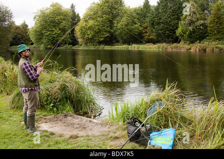 Fisherman fly fishing at Avington Trout Fishery, Winchester, Hampshire ...