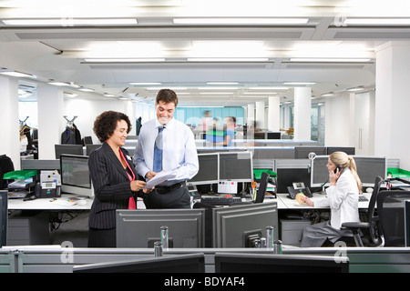 happy supervisor or manager busy talking on mobile phone while at ...