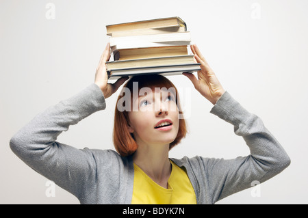 A woman balancing a book on her head during deportment classes. October ...
