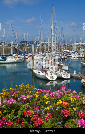 The marina, St Peter's Port, Guernsey, showing boats and the town in ...