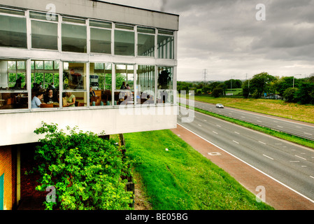 M6 motorway at Lancaster service station with footbridge over the ...
