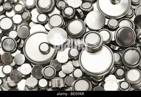 Button shape lithium batteries of various sizes on white background ...