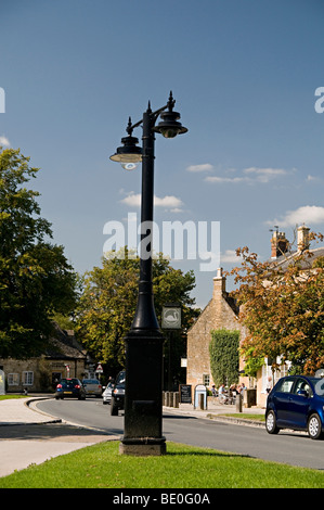 Blue surveillance camera security sign on stone wall in residential ...
