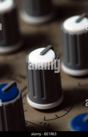 High fidelity audio mixing console with multiple knobs and sliders in a ...
